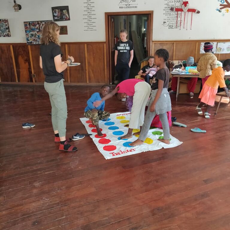 teaching how to play twister - American Foundation for Children with Aids